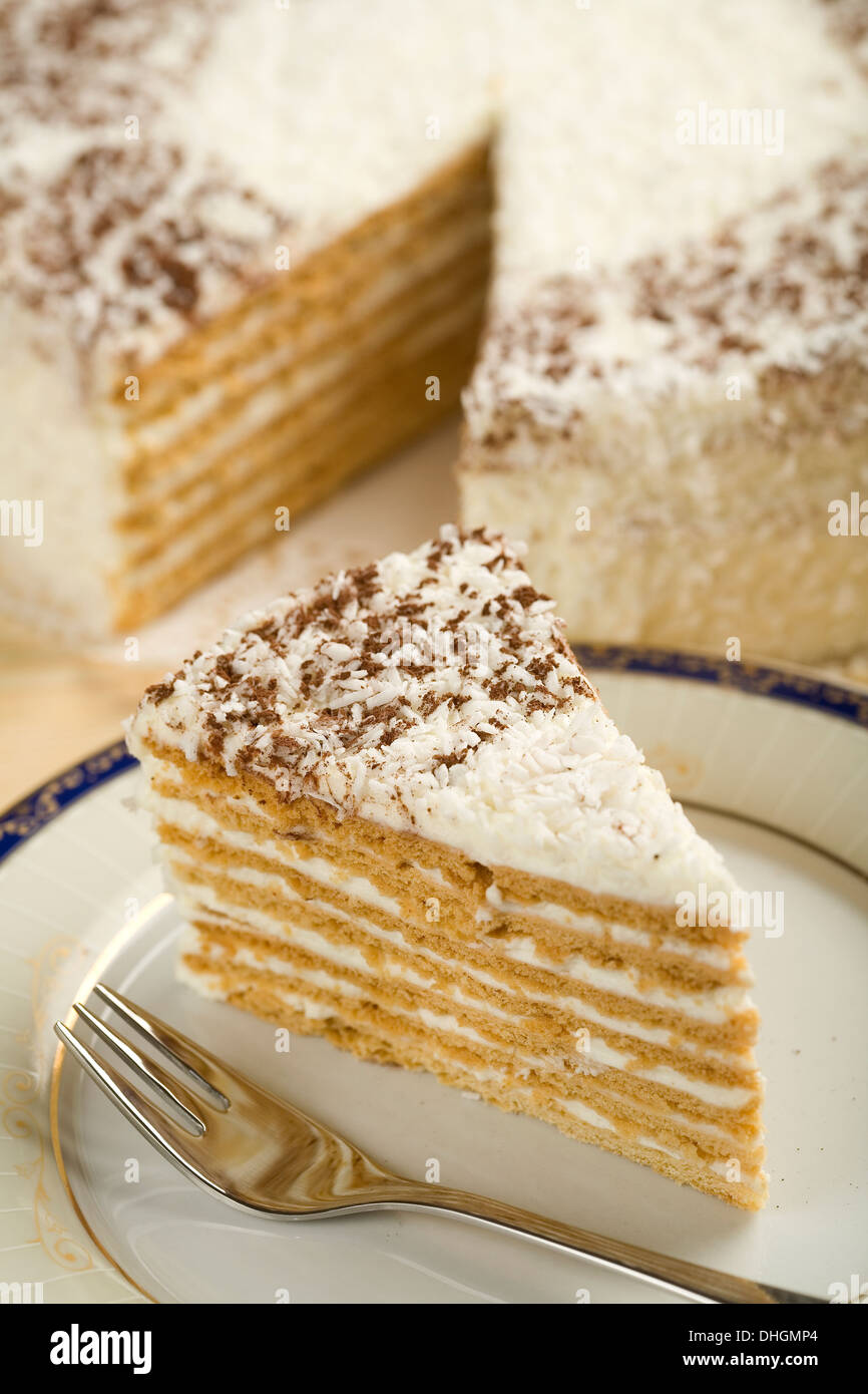Triangle cut piece of coconut cake Stock Photo - Alamy