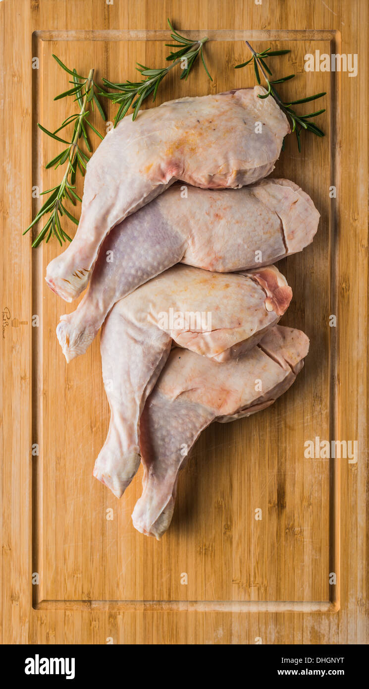 Raw chicken on wood plate Stock Photo - Alamy