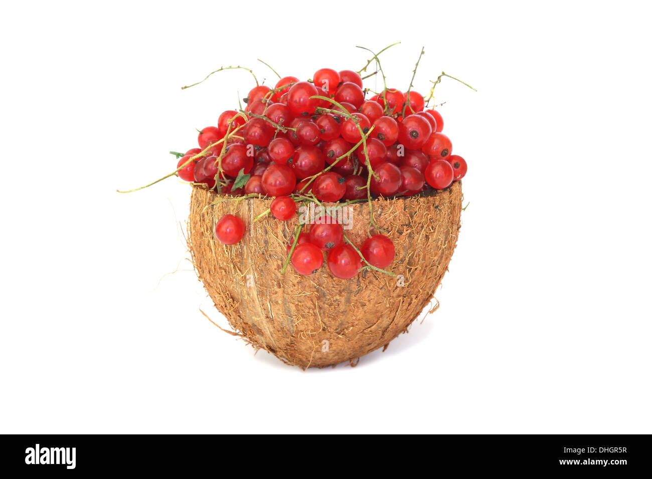Red currants in a coconut shell isolated on white background Stock ...