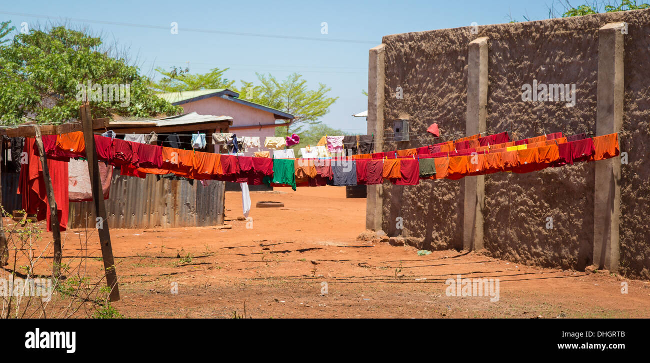 Children's school uniforms drying on a washing line in a primaryschool ...