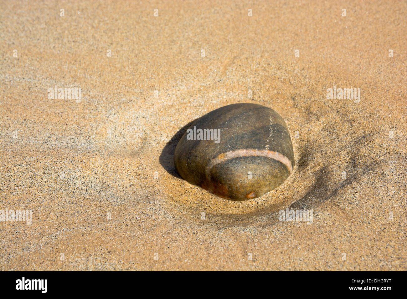 Wet Sand And Isolated Stone Stock Photo - Alamy