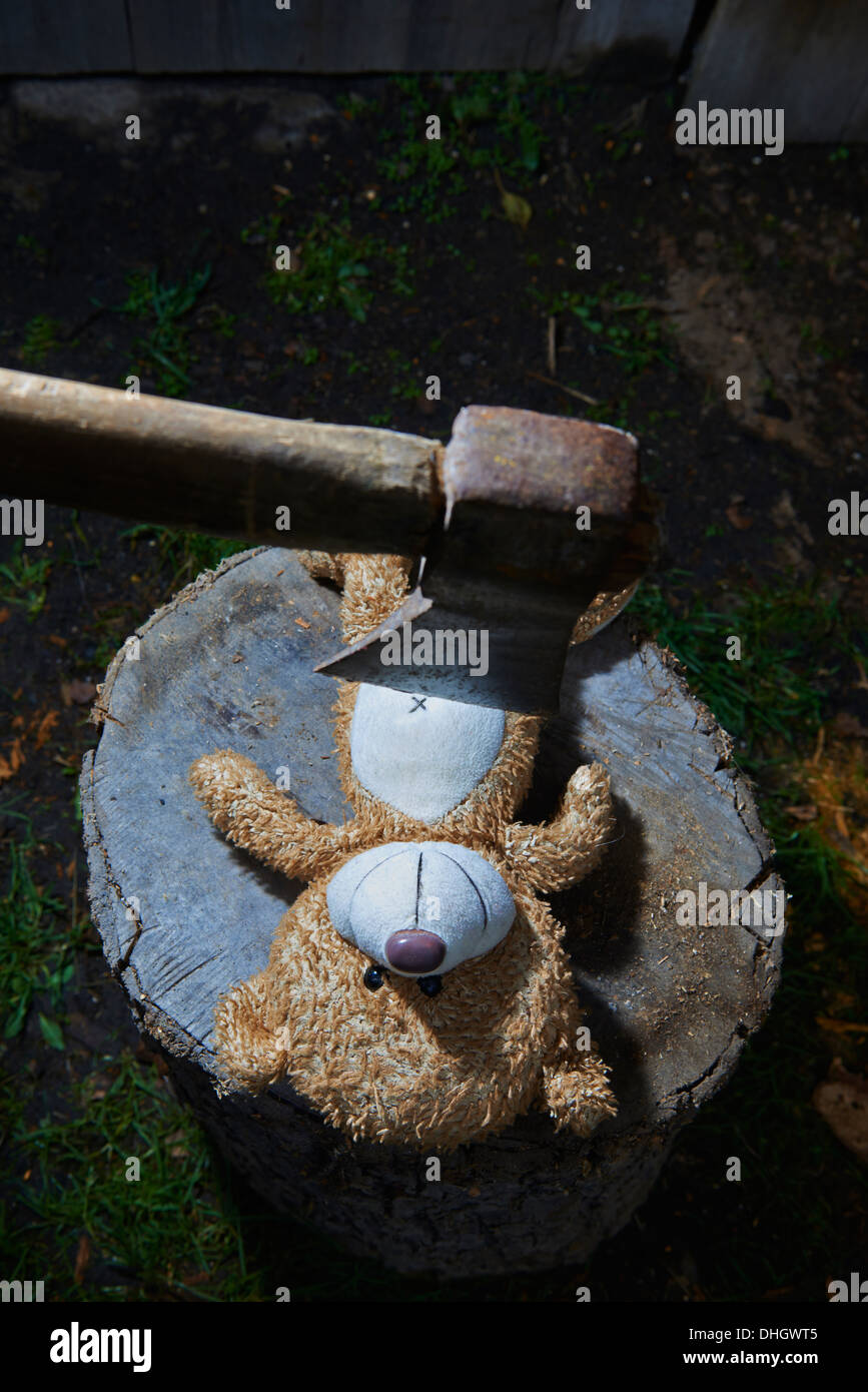 Execution of child toy teddy bear with an ax Stock Photo - Alamy