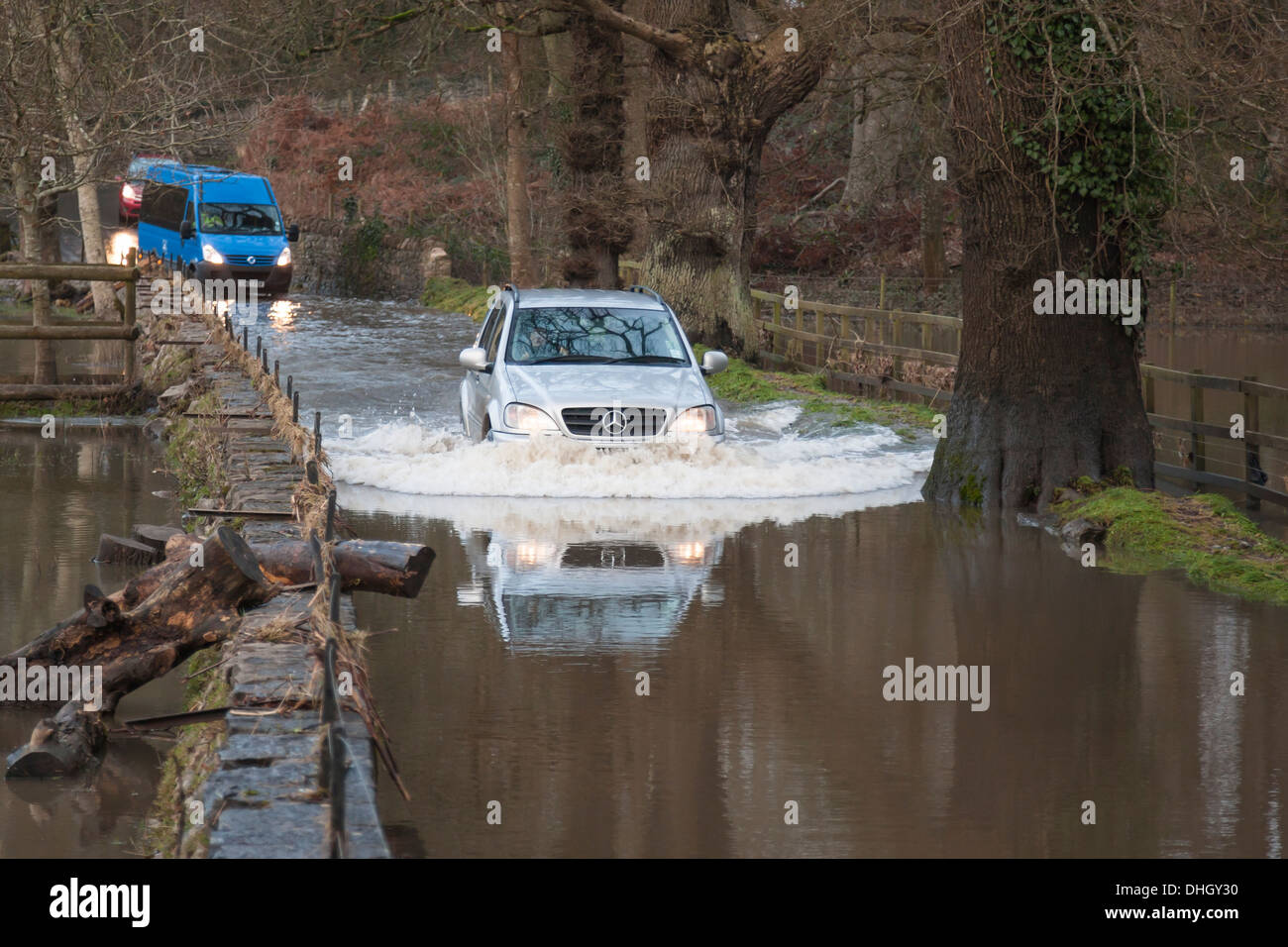 Car driving through flood Stock Photo - Alamy
