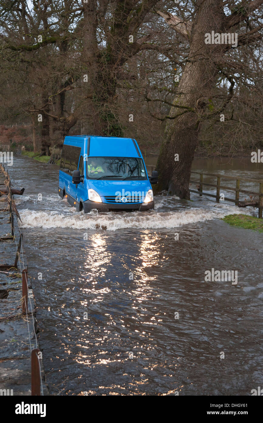 Van driving through flood Stock Photo - Alamy