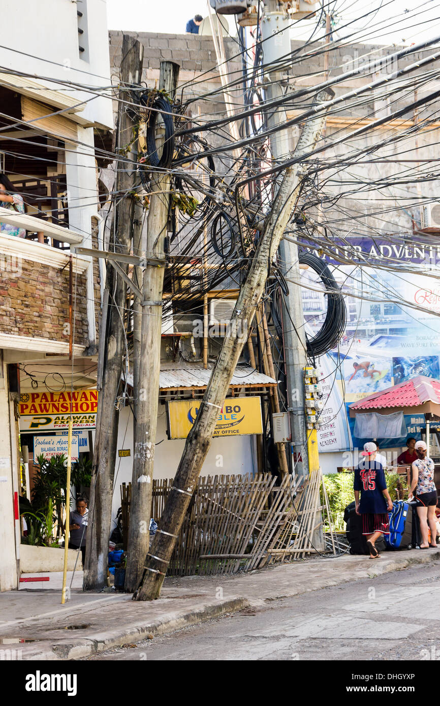 BORACAY, PHILIPPINES - NOVEMBER 9 2013: A power line and pole lines ...