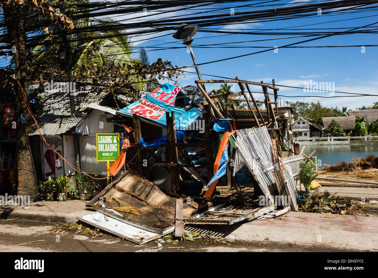 BORACAY, PHILIPPINES - NOVEMBER 9 2013: A wooden shack lies completely in ruins following Super ...