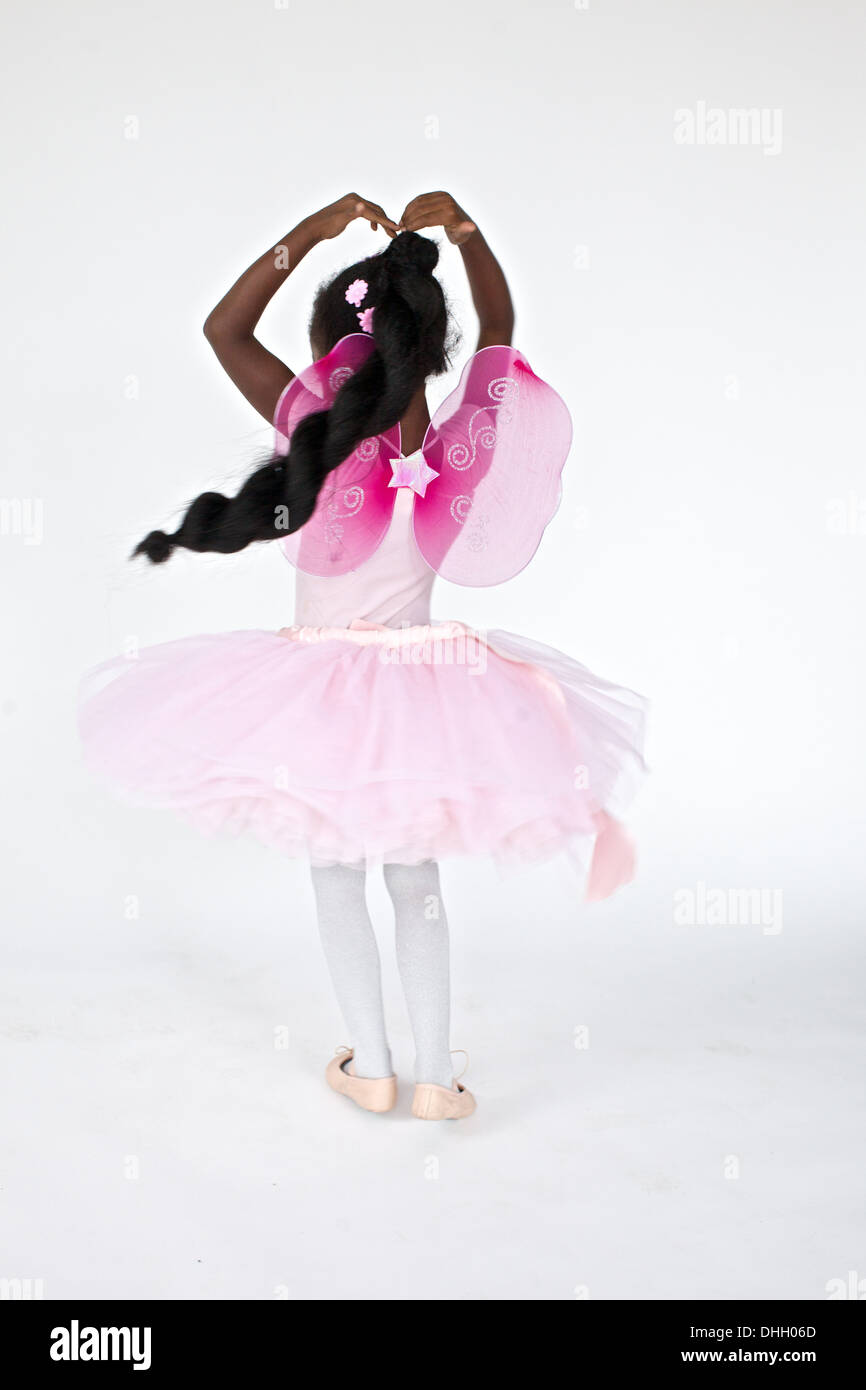 Little girl with big hair executes a perfect twirl, braid akimbo Stock ...