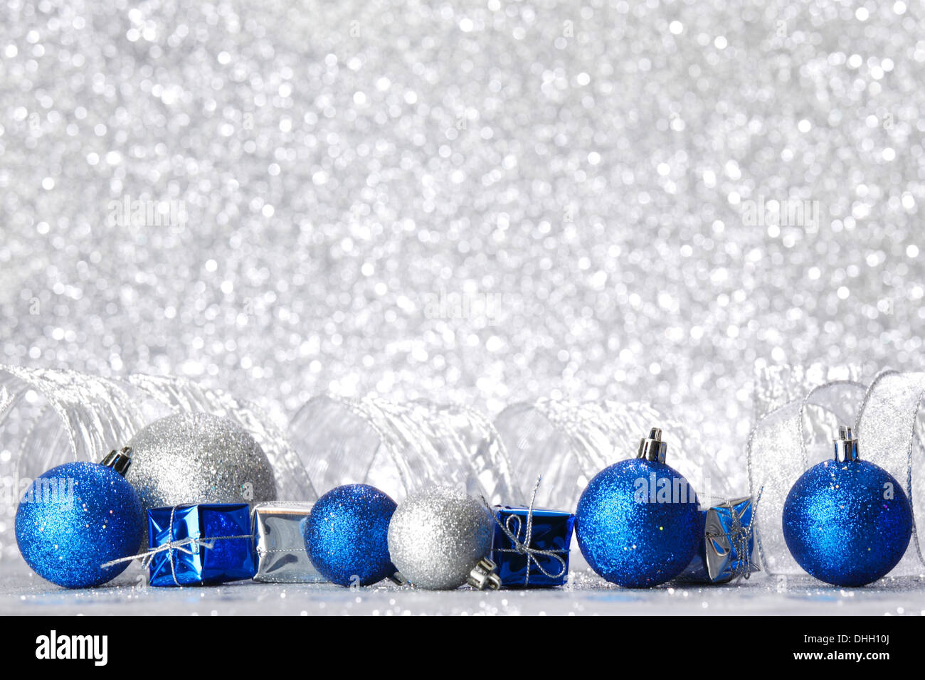 Christmas balls and gifts on silver glitter background Stock Photo - Alamy