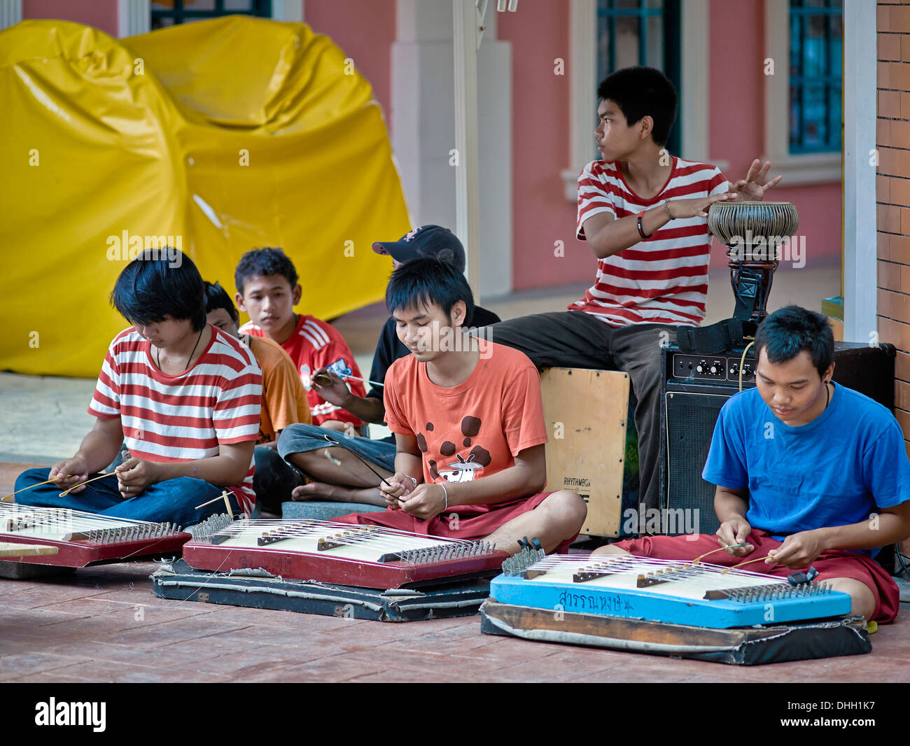 Thai youth group playing the Khim, a hammer dulcimer musical ...