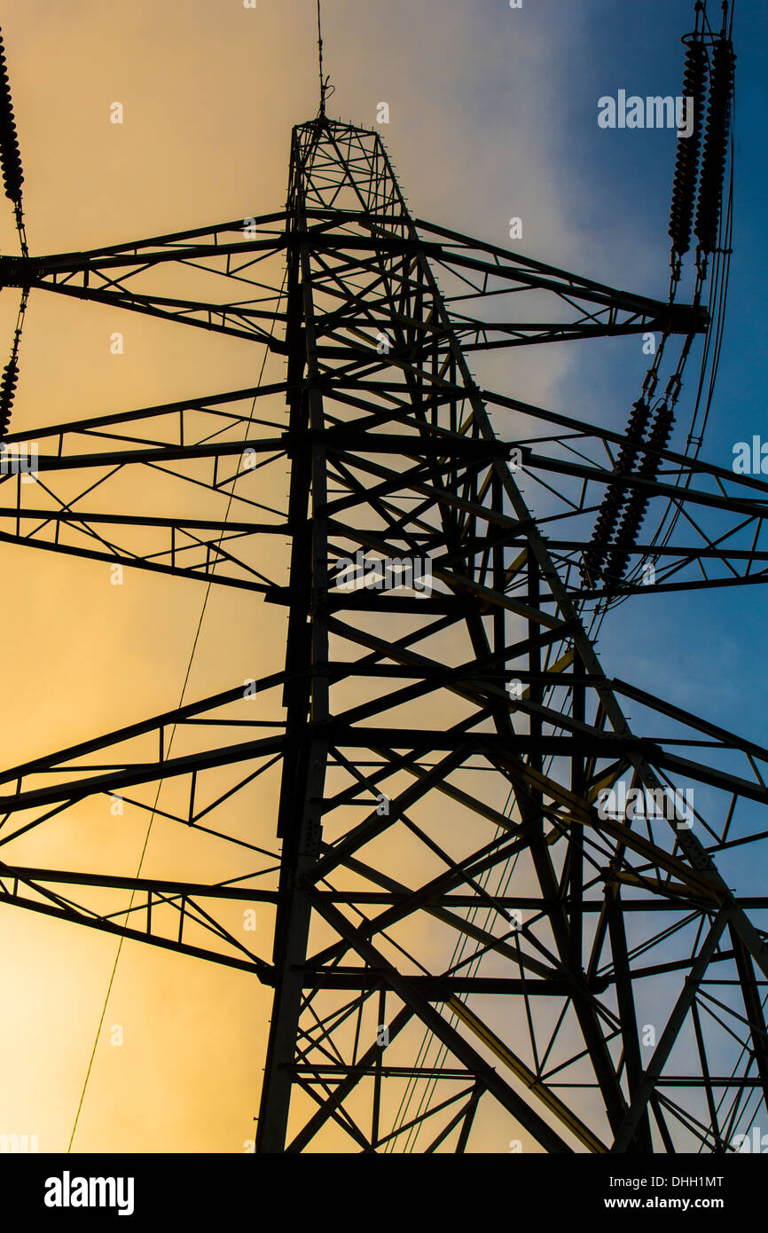 A pylon in the sun setting sky Stock Photo - Alamy