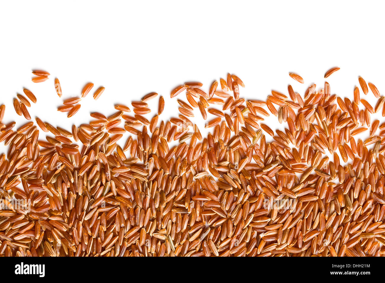 red raw rice on white background Stock Photo - Alamy