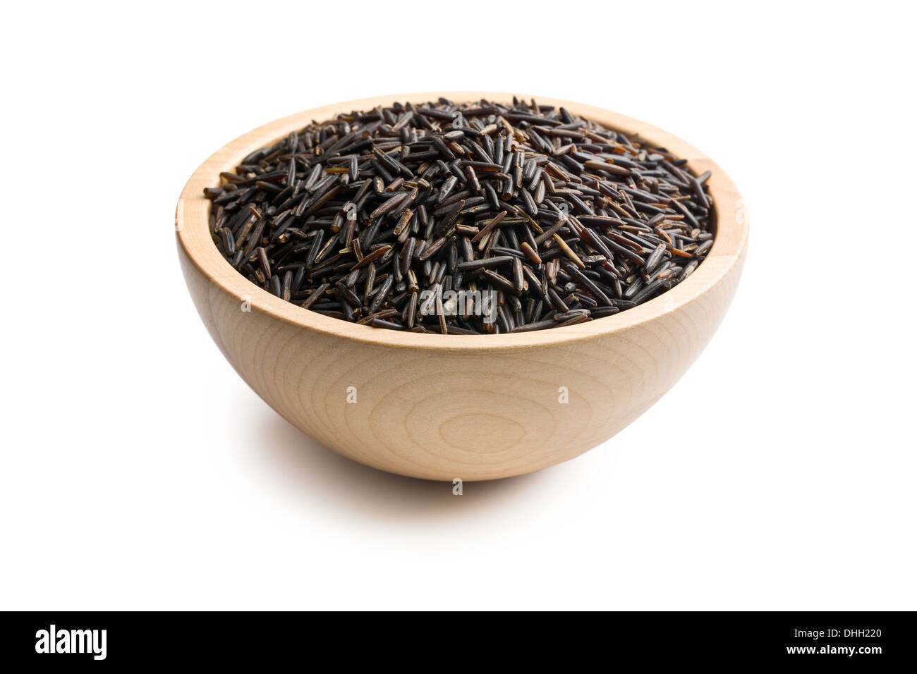 wild rice in wooden bowl on white background Stock Photo - Alamy