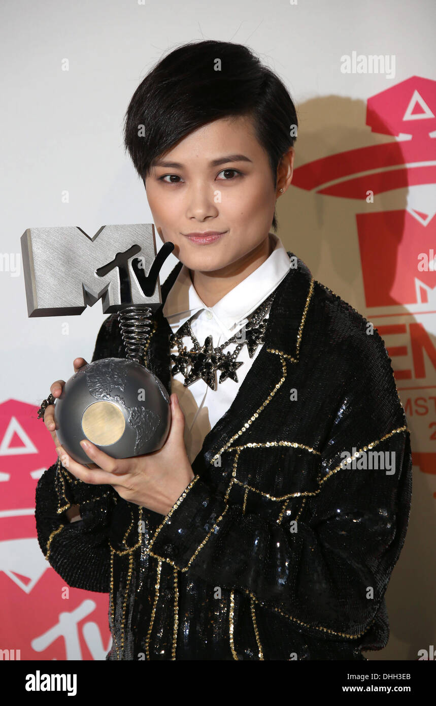 Chinese singer Chris holds her award for Best Worldwide Act at the MTV ...