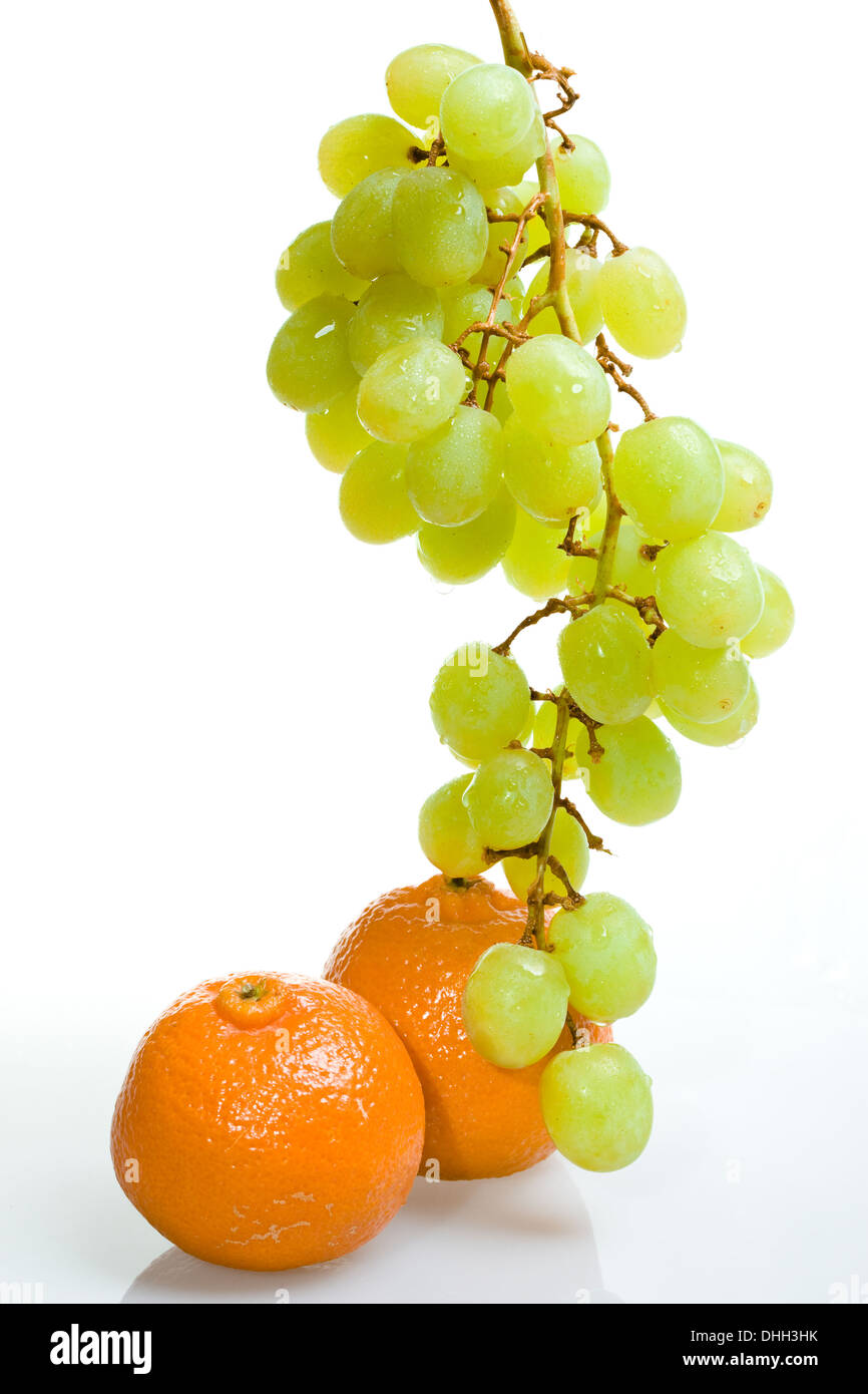 Cluster of grapes and tangerine Stock Photo - Alamy