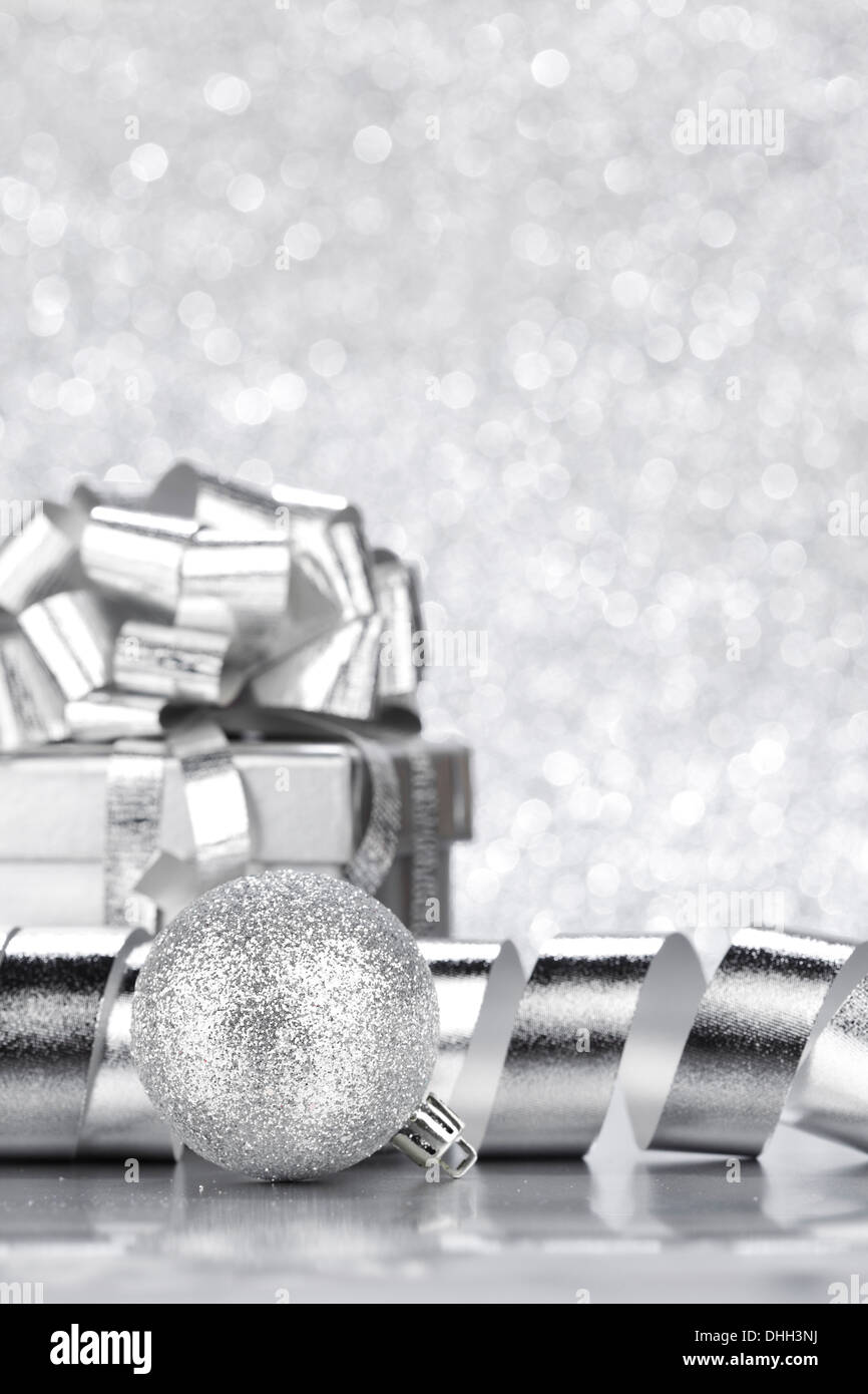 Christmas gift box with decoration on shiny background Stock Photo - Alamy