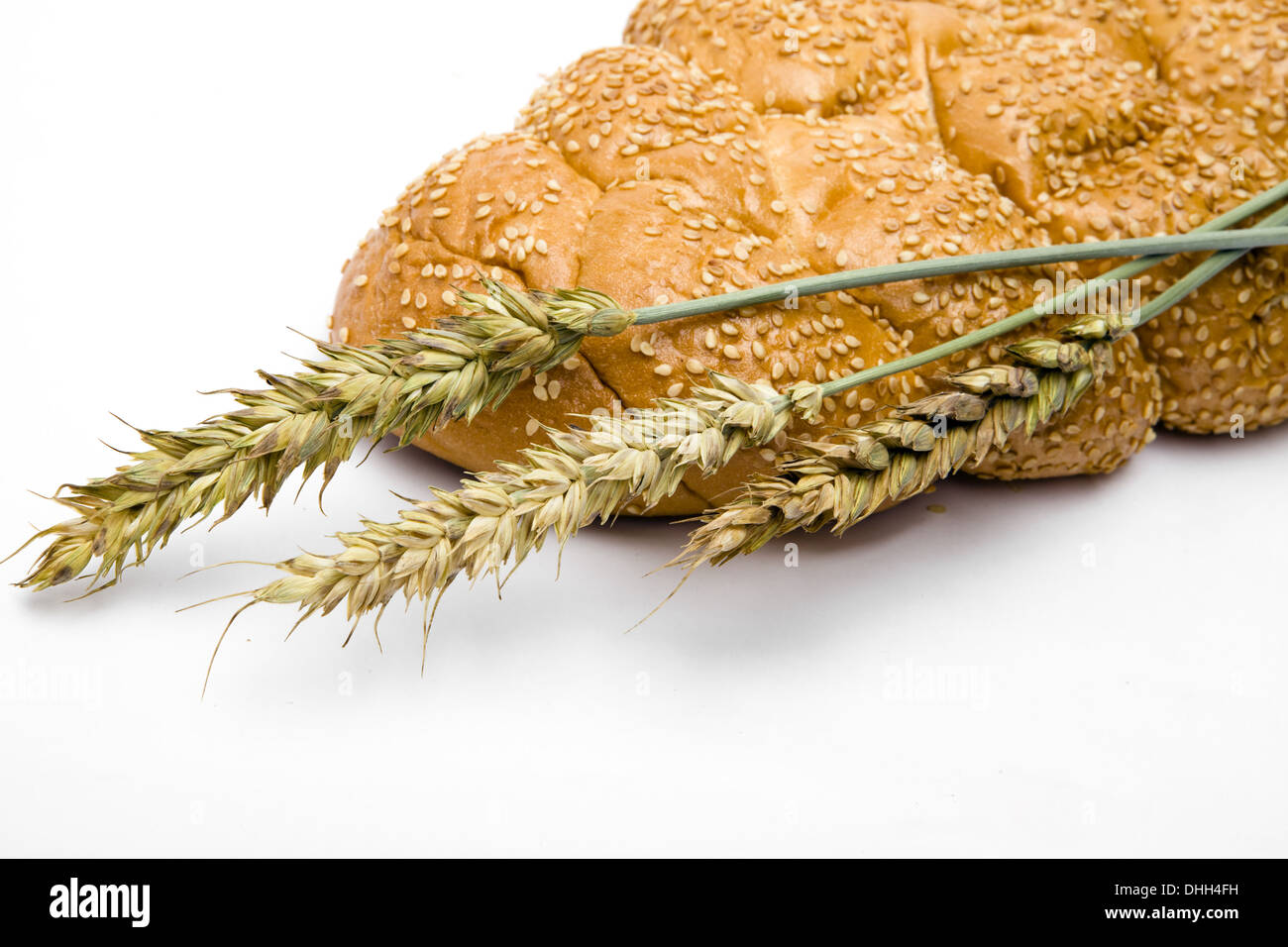 Wheat and bread on white background Stock Photo - Alamy