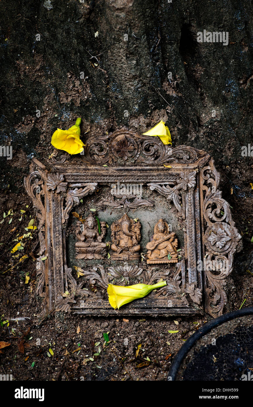 Hindu deity statues in a frame at and old indian hindu temple shrine ...