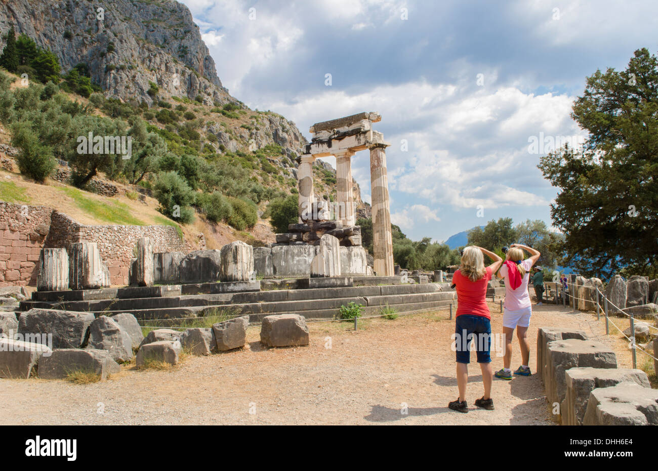 Greece Delphi famous Greek Temple of Athena tourists taking photos at ...