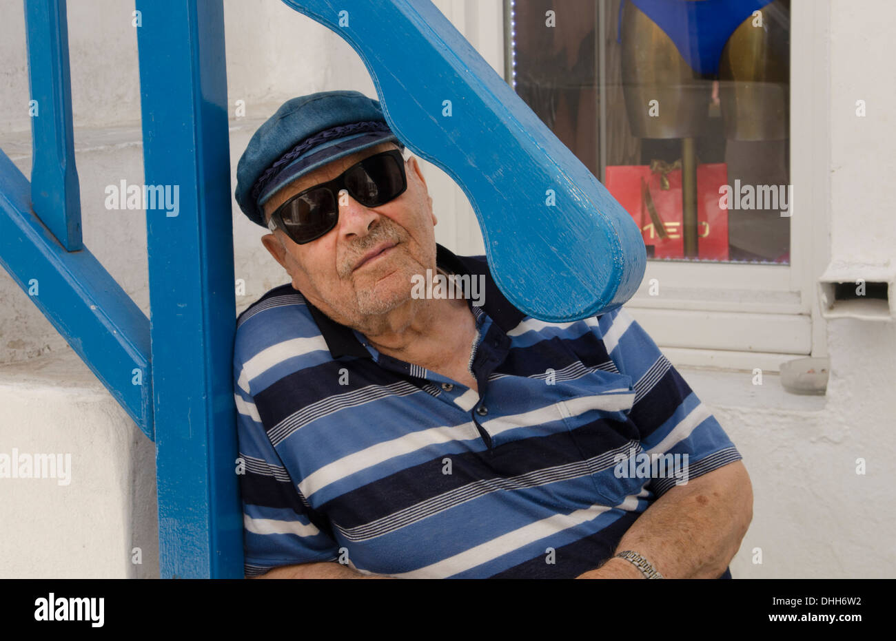Mykonos Greece old Greek man with Greek hat under blue stairs 15 Stock ...