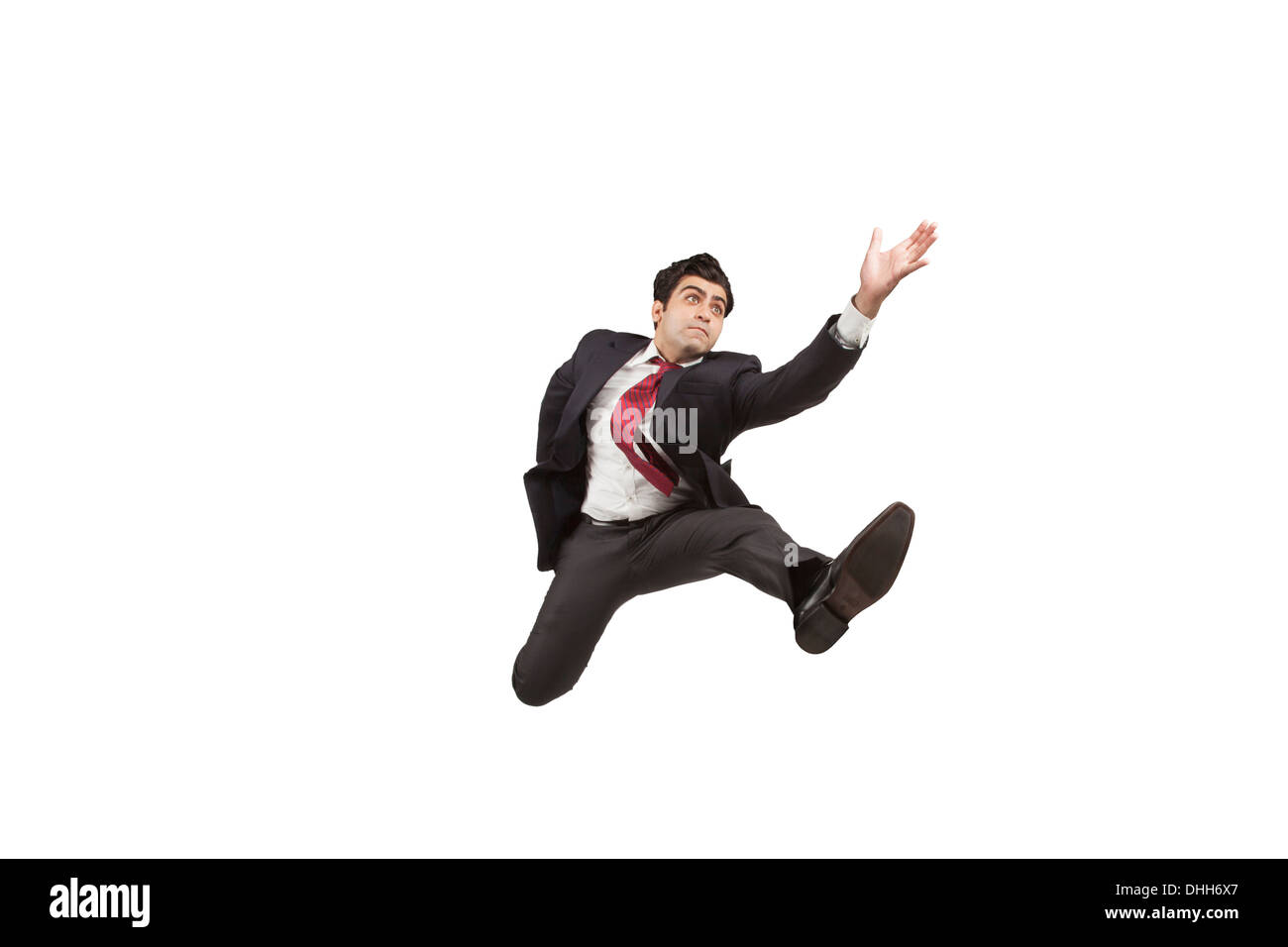 Man in suit chasing his goals Stock Photo - Alamy