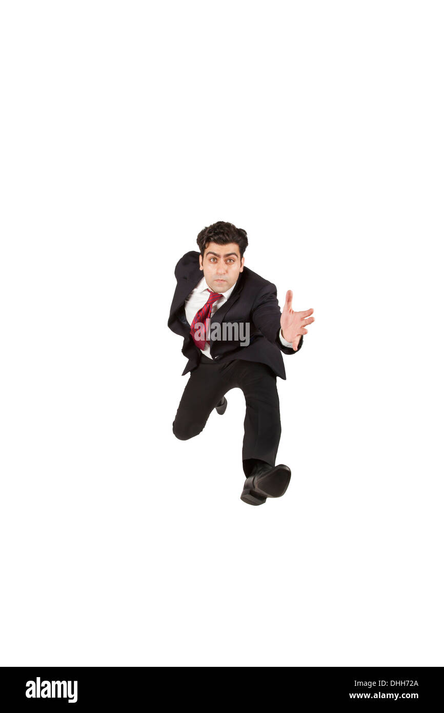 Business man jumping and running forward Stock Photo - Alamy
