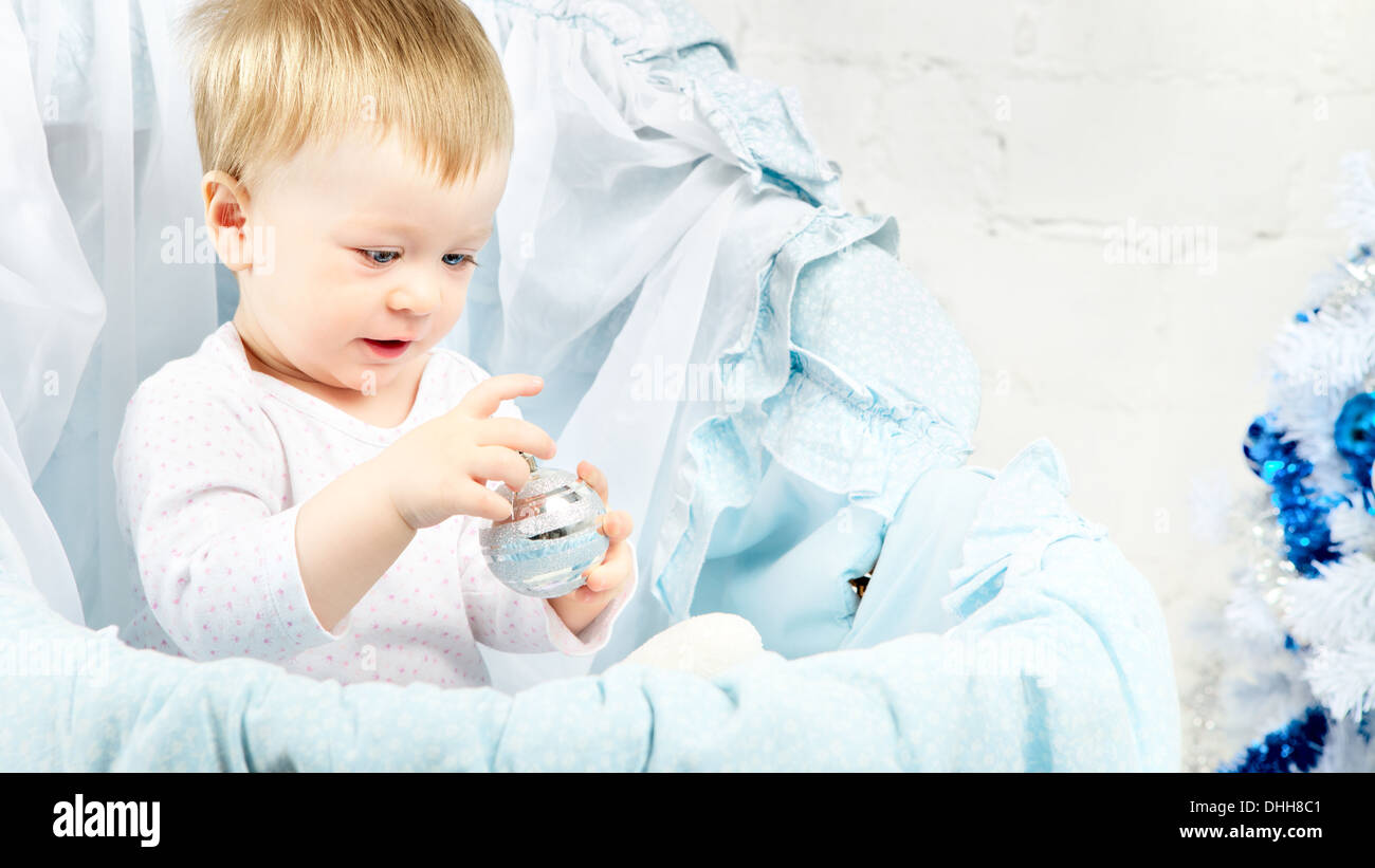 Child in Cradle Stock Photo - Alamy