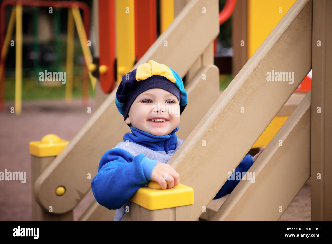 Boy Playing on Playground Stock Photo - Alamy
