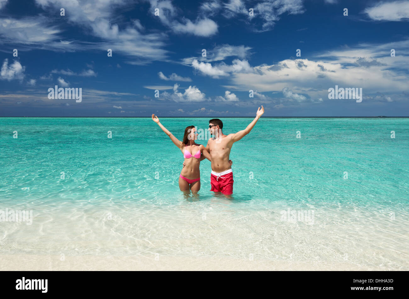 Couple on a beach at Maldives Stock Photo - Alamy
