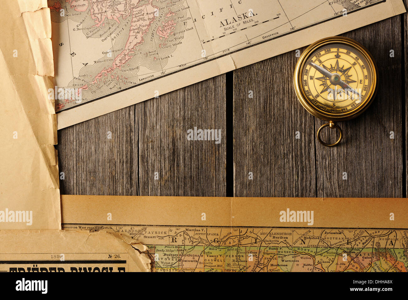 Antique compass over old map Stock Photo - Alamy