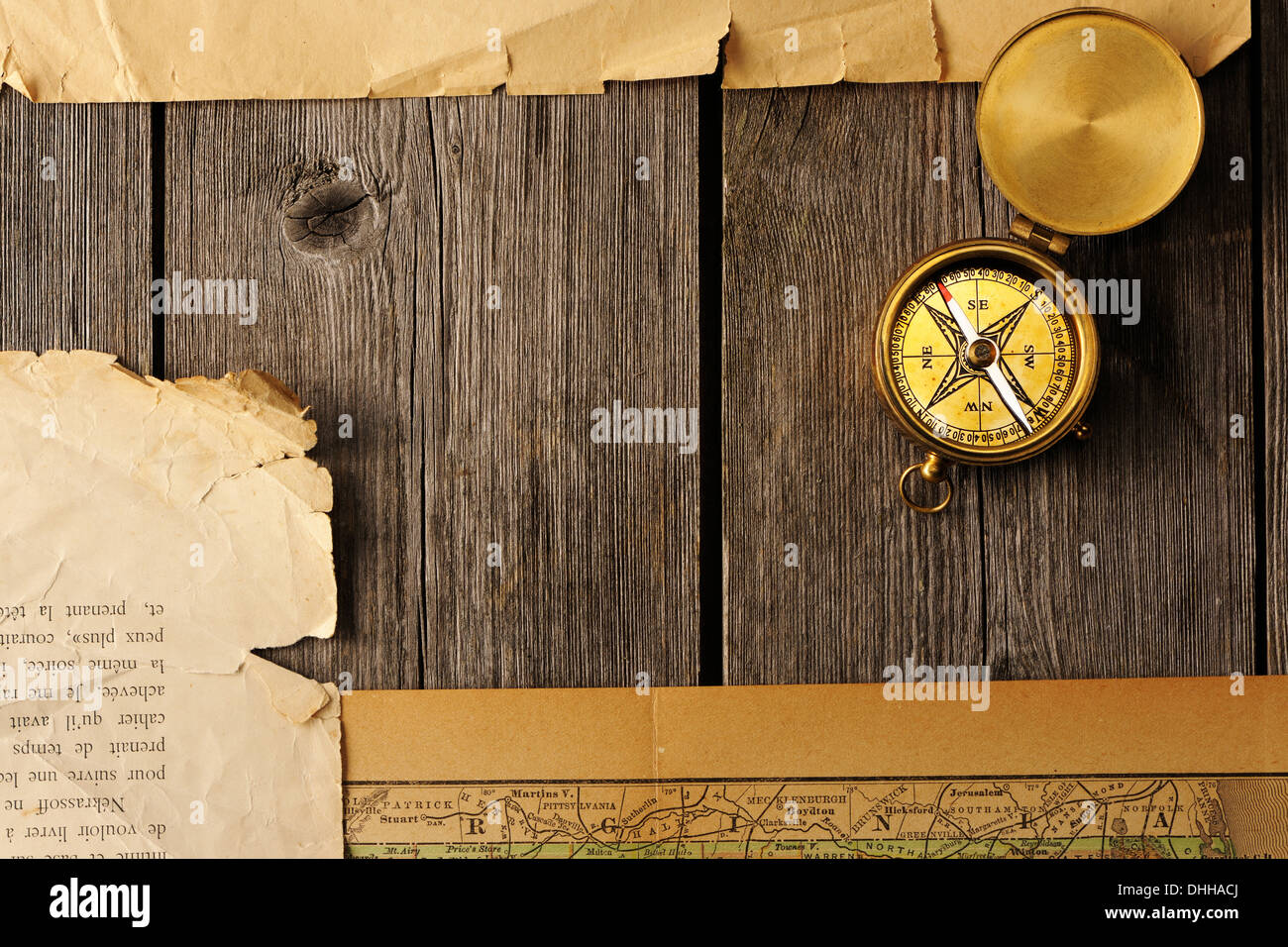 Antique compass over old map Stock Photo - Alamy