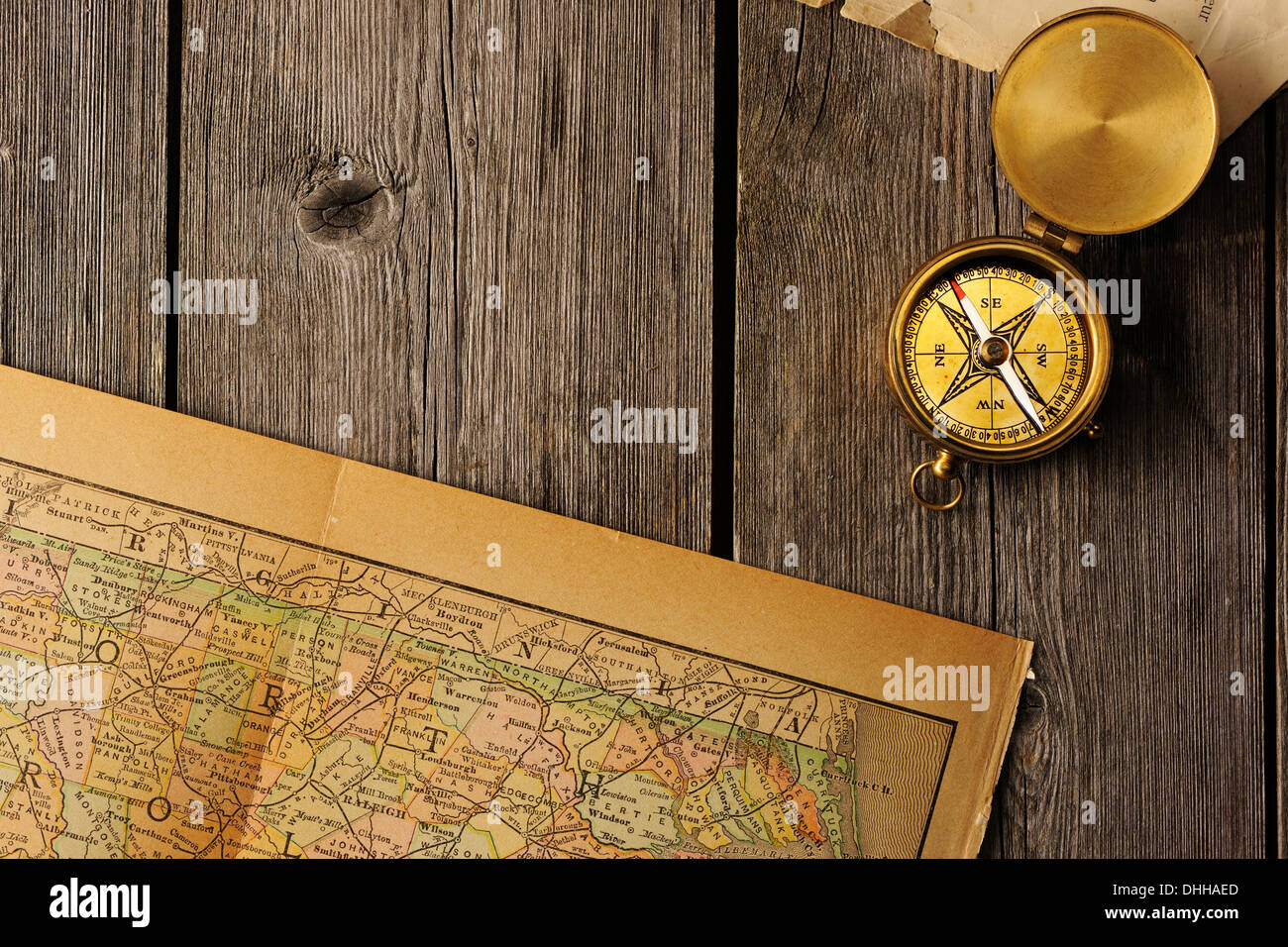 Antique compass over old map Stock Photo - Alamy