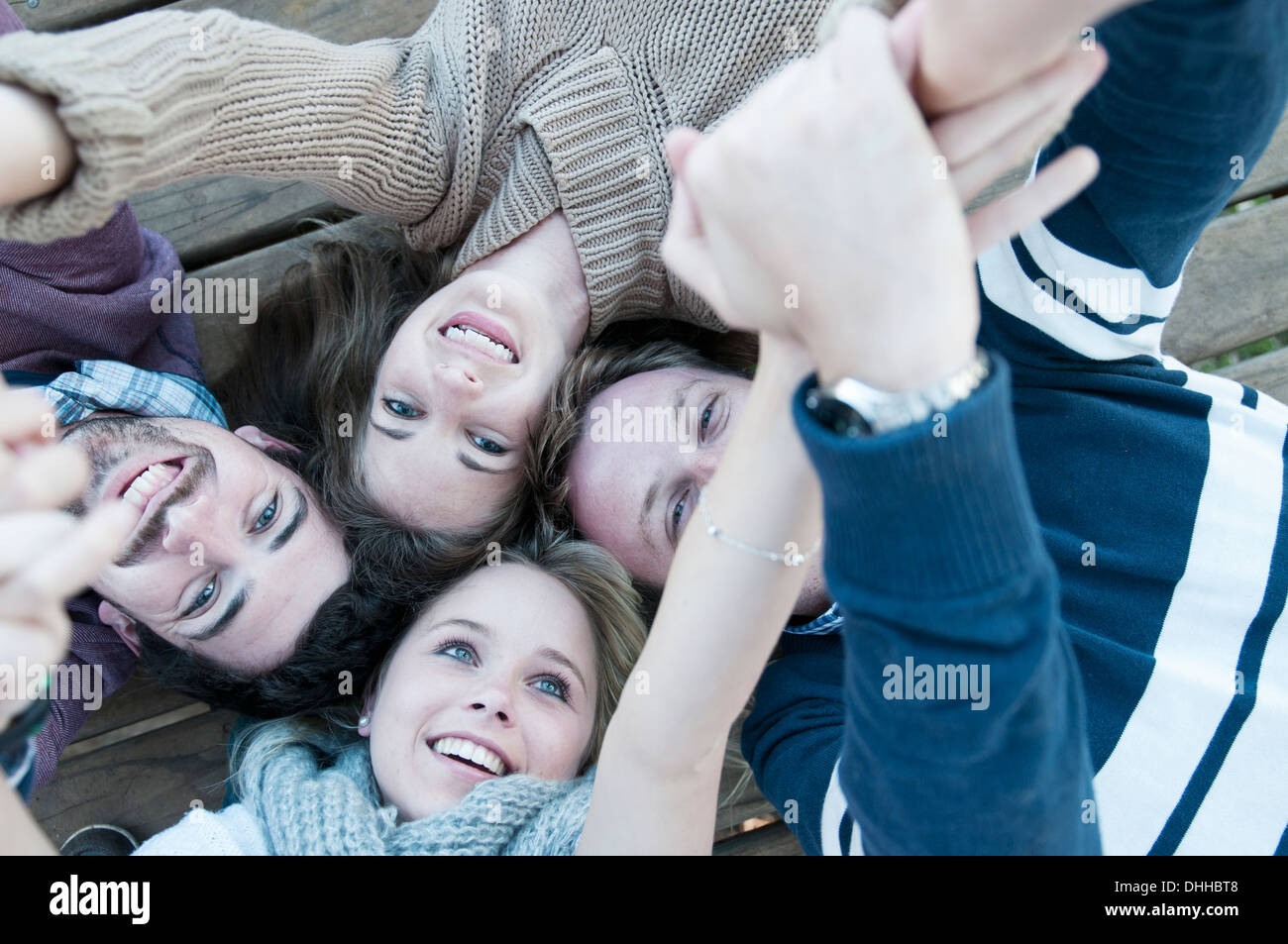 Heads together hi-res stock photography and images - Alamy