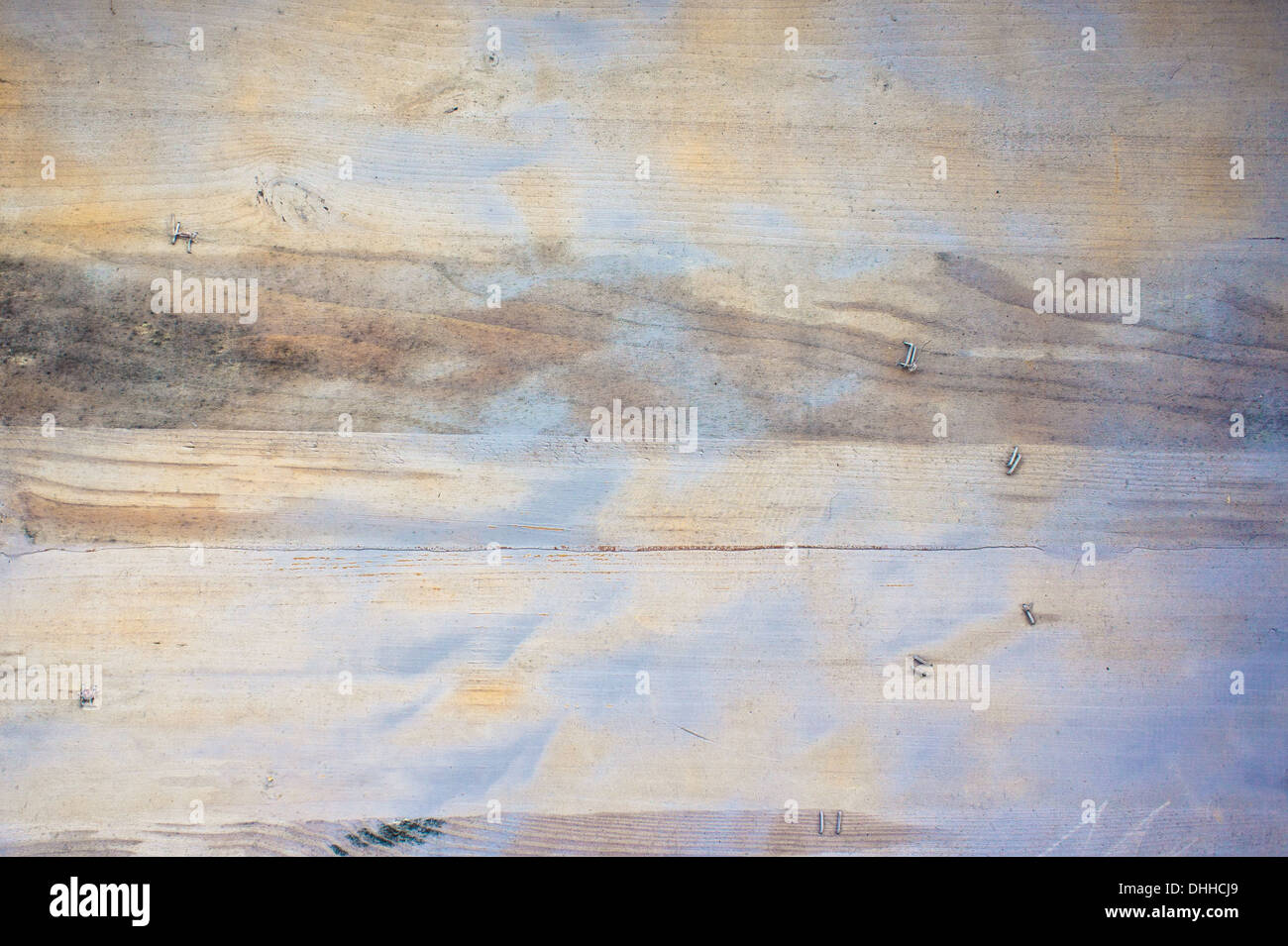 Blue paint marks on a wood panel as a background Stock Photo - Alamy