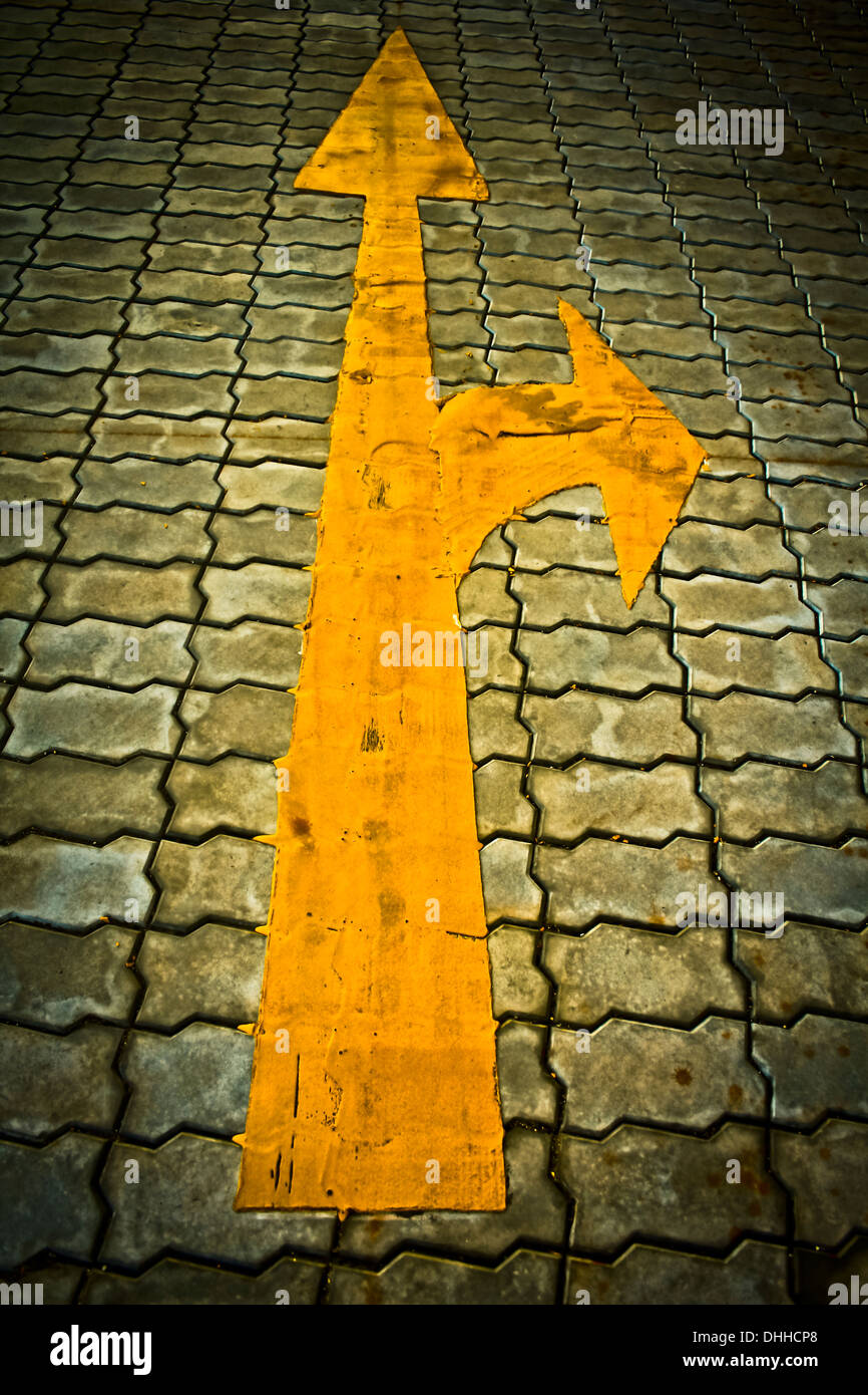 Arrows indicate the direction to be followed by vehicles Stock Photo ...