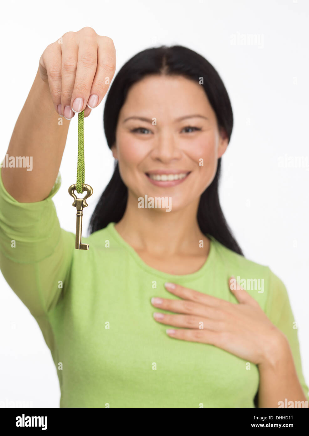 Asian woman hold old key on white Stock Photo - Alamy