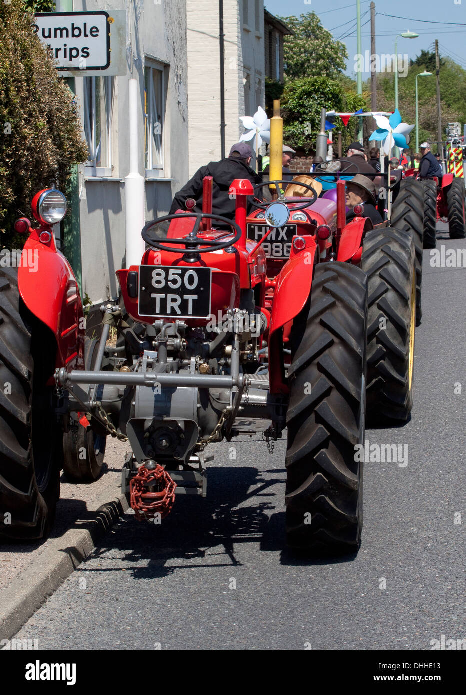 Rear view of vintage red tractors waiting to join a parade Stock Photo ...