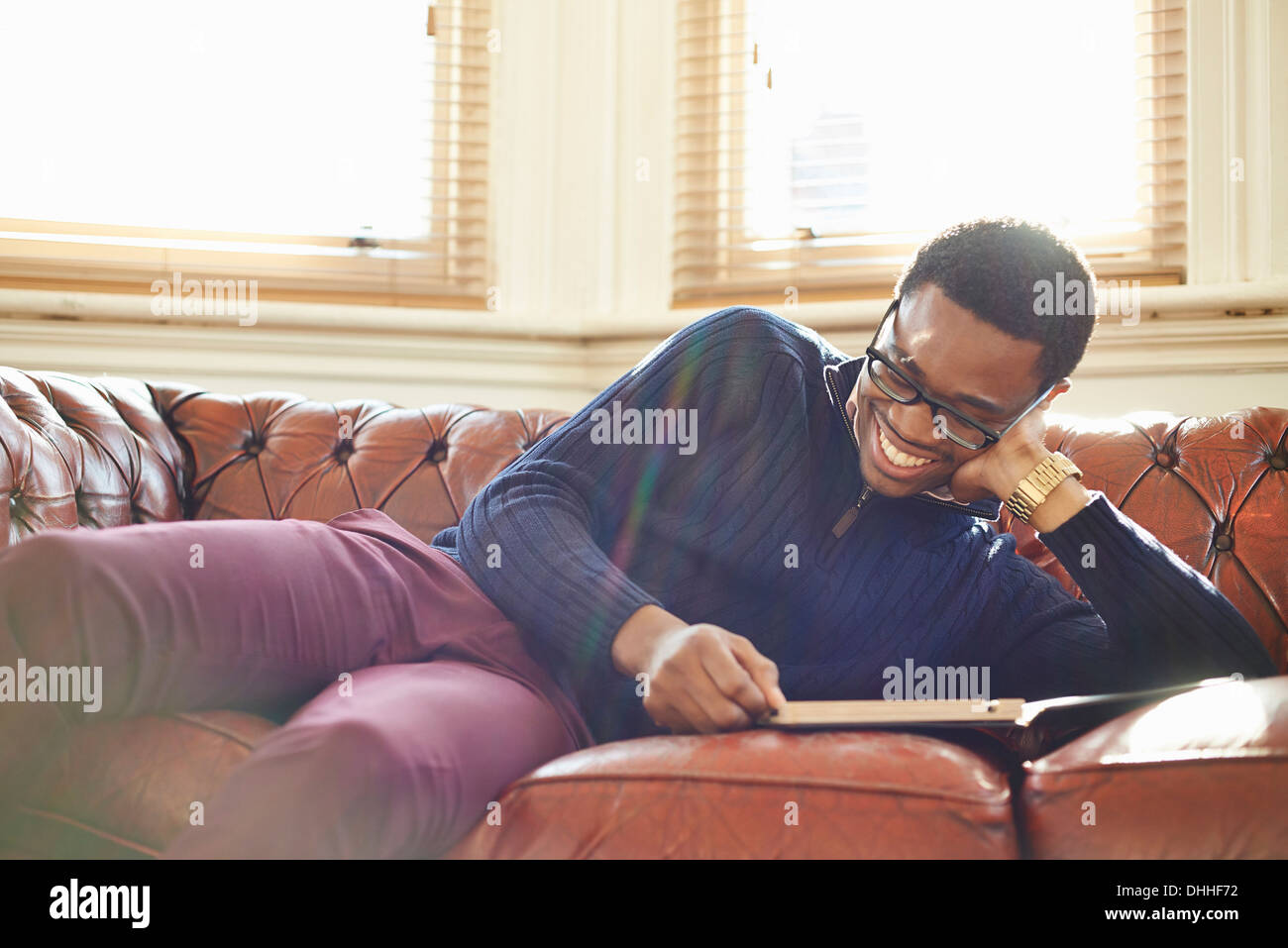 Young smiling man reading hi-res stock photography and images - Alamy
