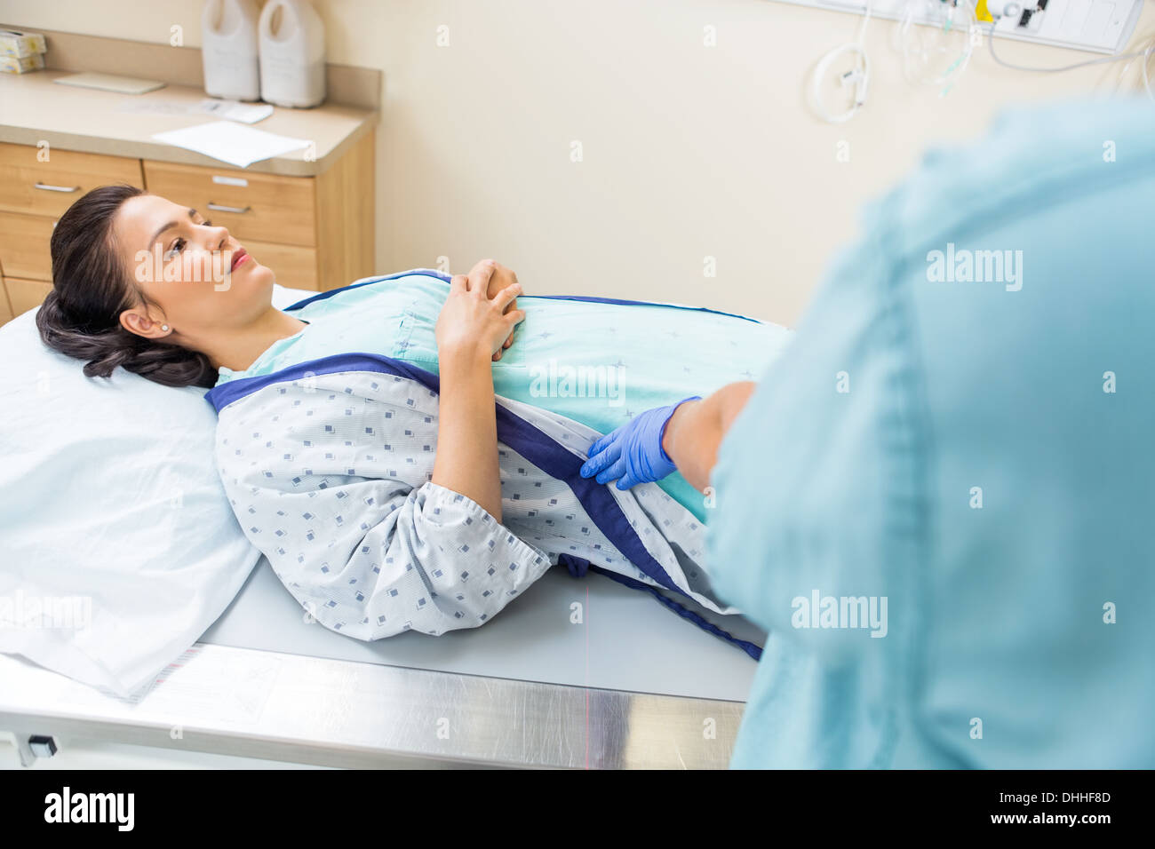 Nurse Preparing Patient In Examination Room Stock Photo - Alamy