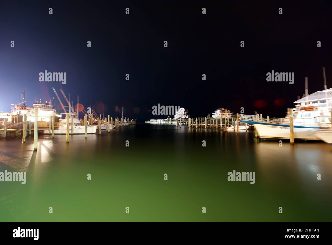 boats in motion on marina at night Stock Photo - Alamy