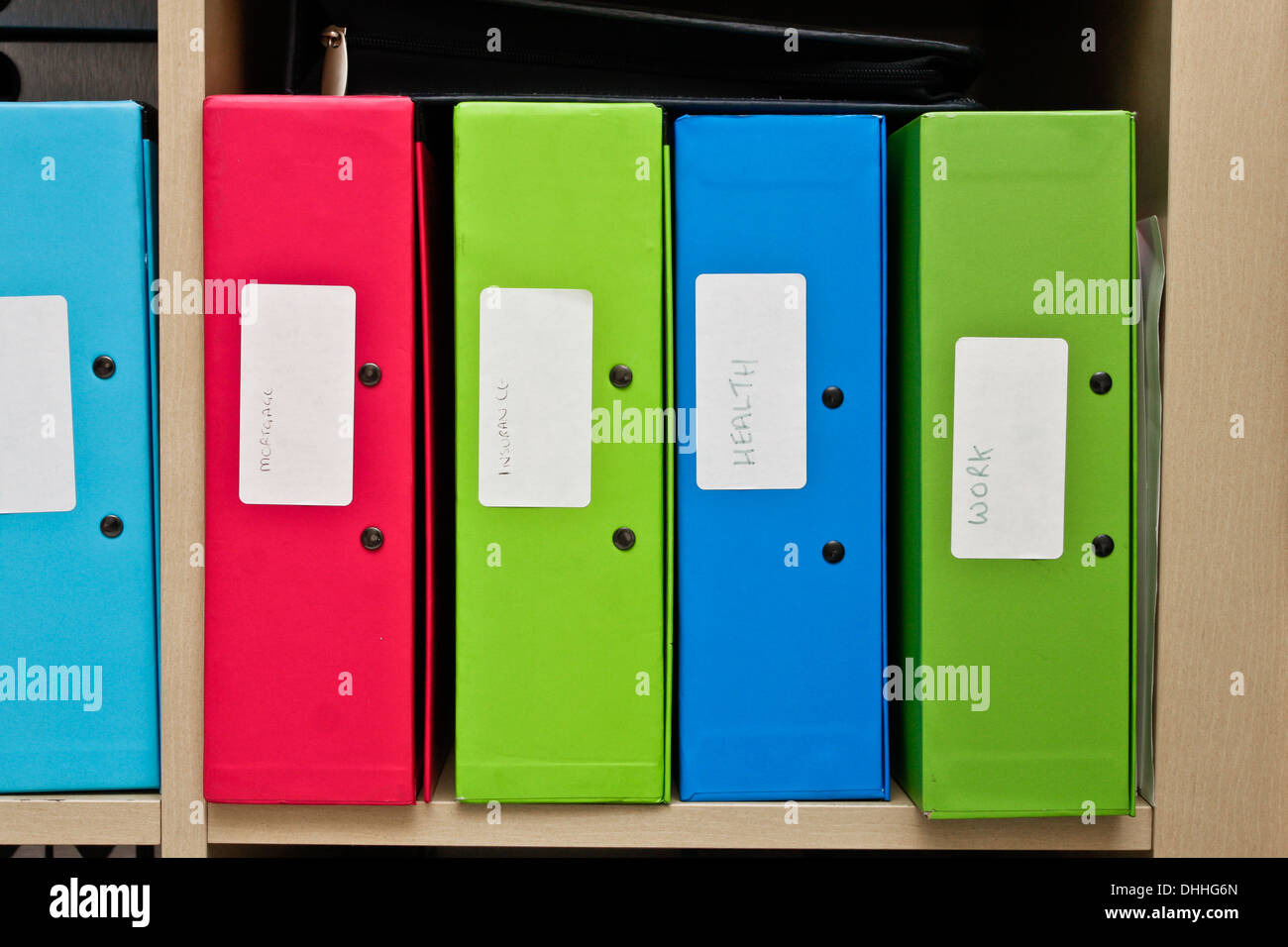 Selection of colorful box files in a home office Stock Photo - Alamy