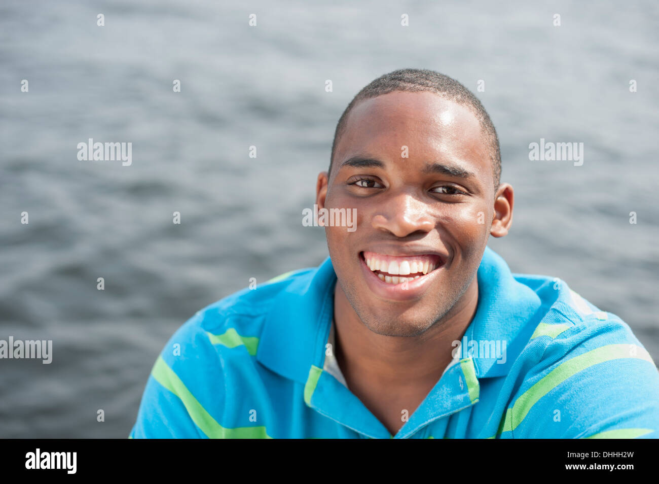 Smiling man blue shirt hi-res stock photography and images - Alamy
