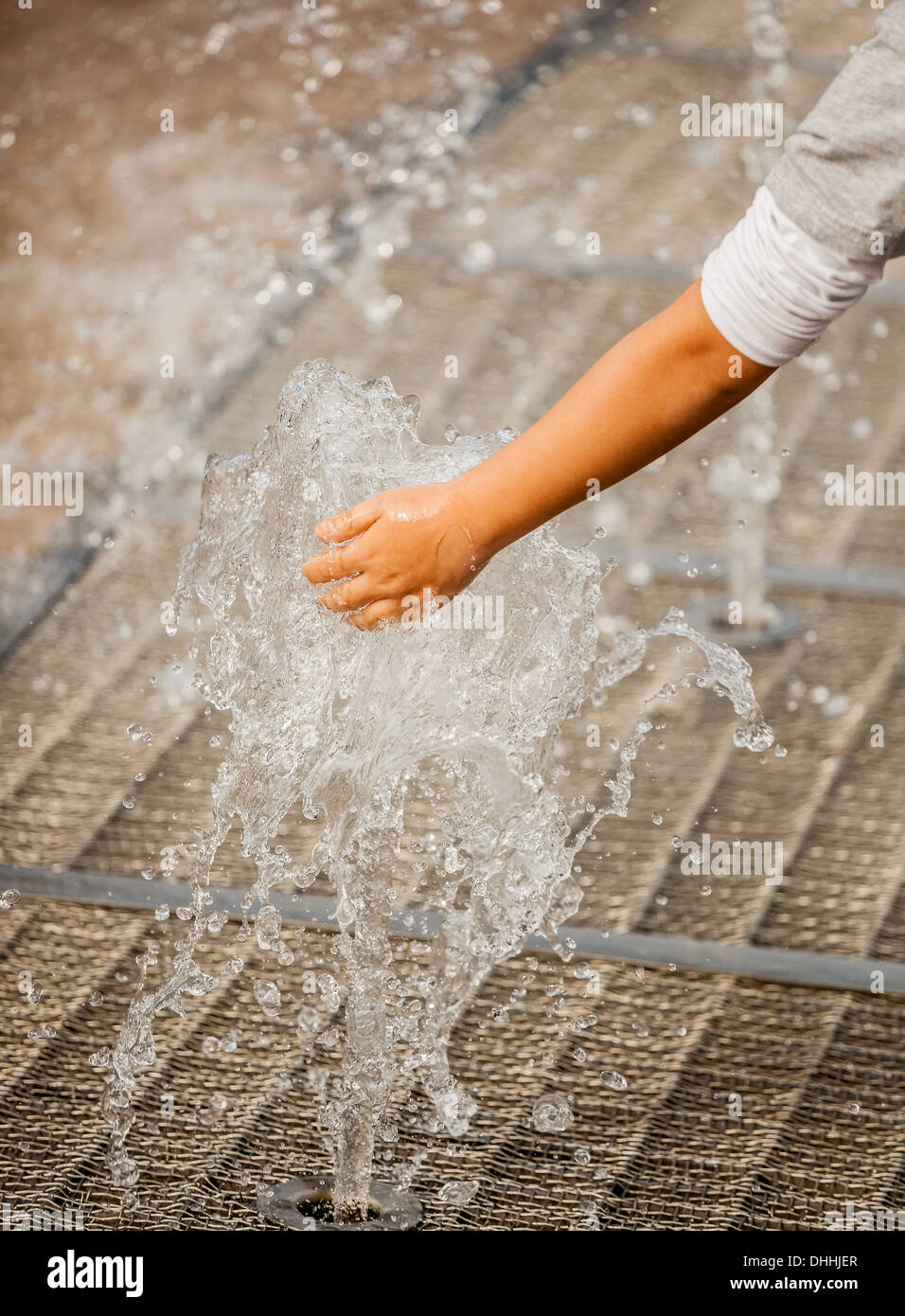 A child Playing with water Stock Photo - Alamy