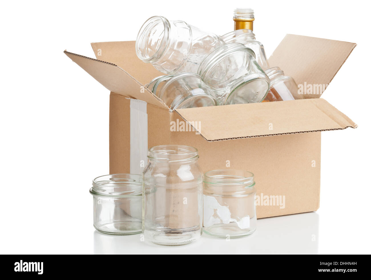 Collected glass bottles in carton box for recycling on white background ...