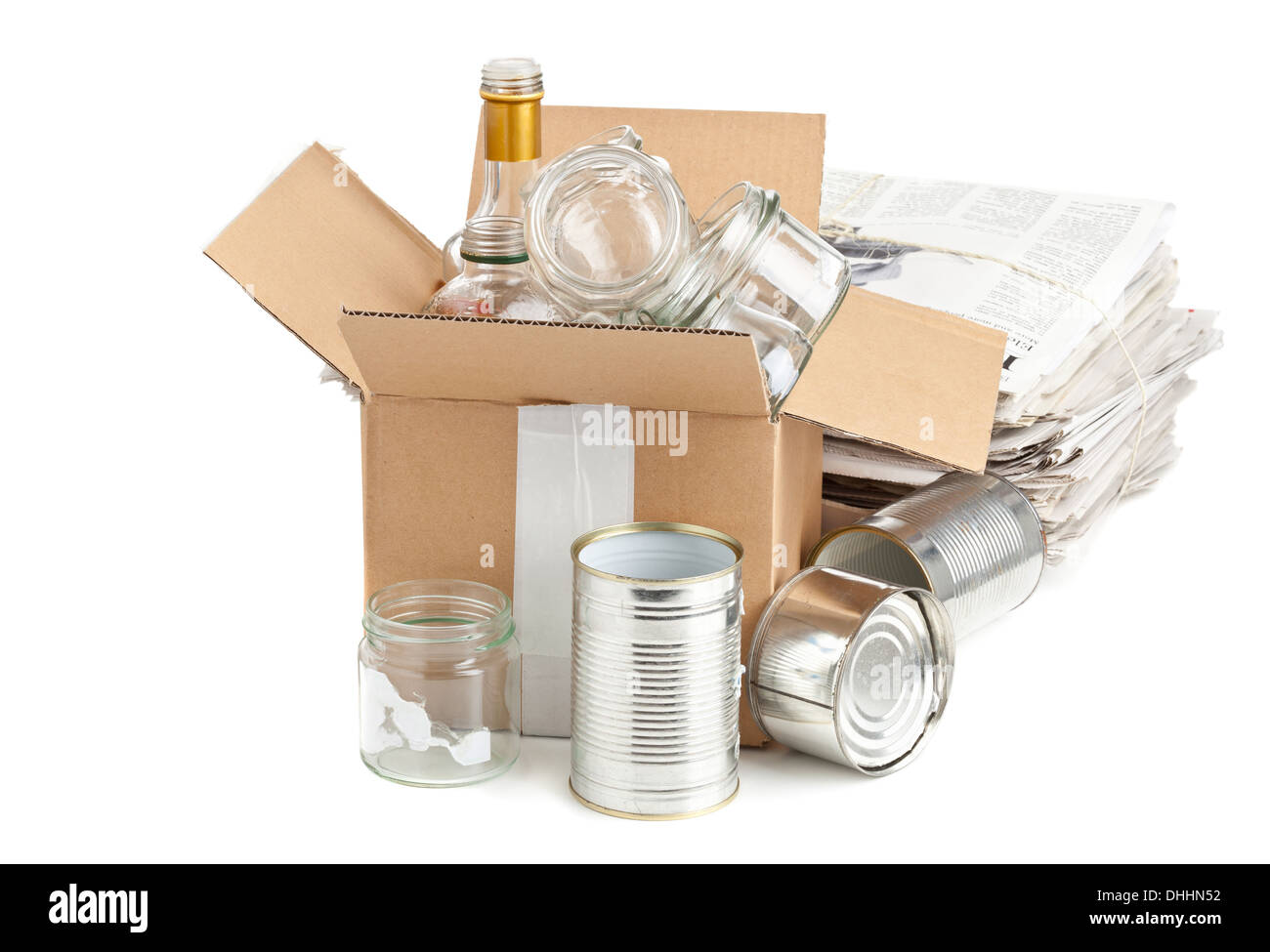 Collected glass bottles, tin cans and newspaper in carton box for ...
