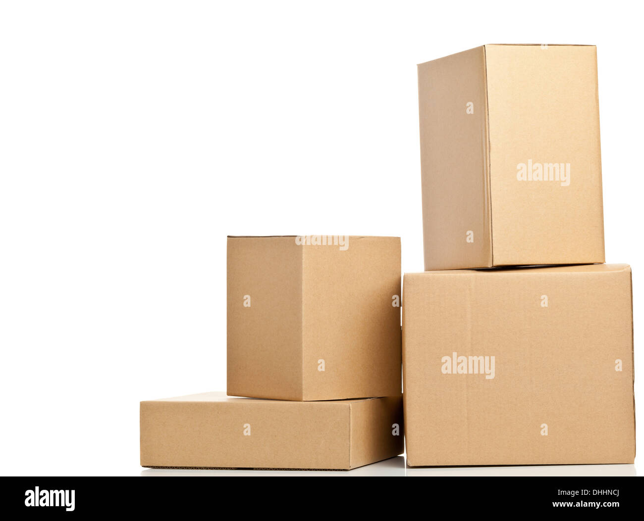 Stacked brown delivery carton boxes on white background Stock Photo - Alamy