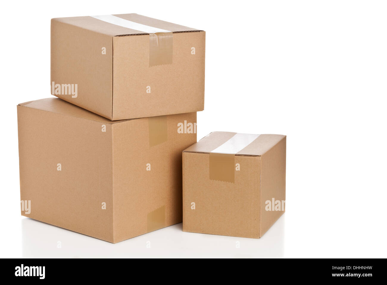 Stacked brown delivery carton boxes on white background Stock Photo - Alamy