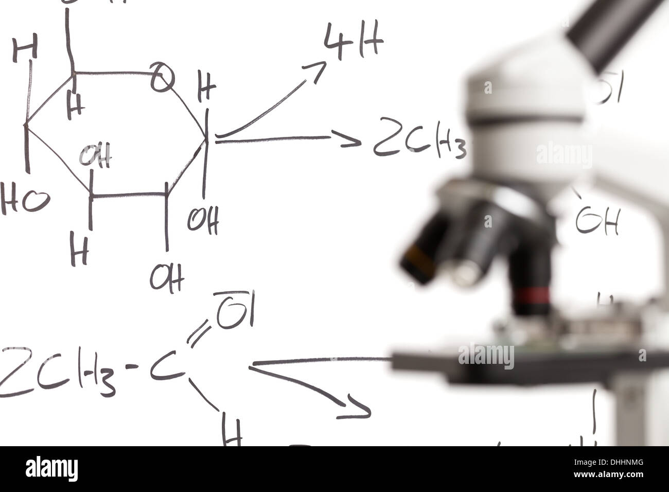 Microscope in front of whiteboard with chemical formula Stock Photo - Alamy