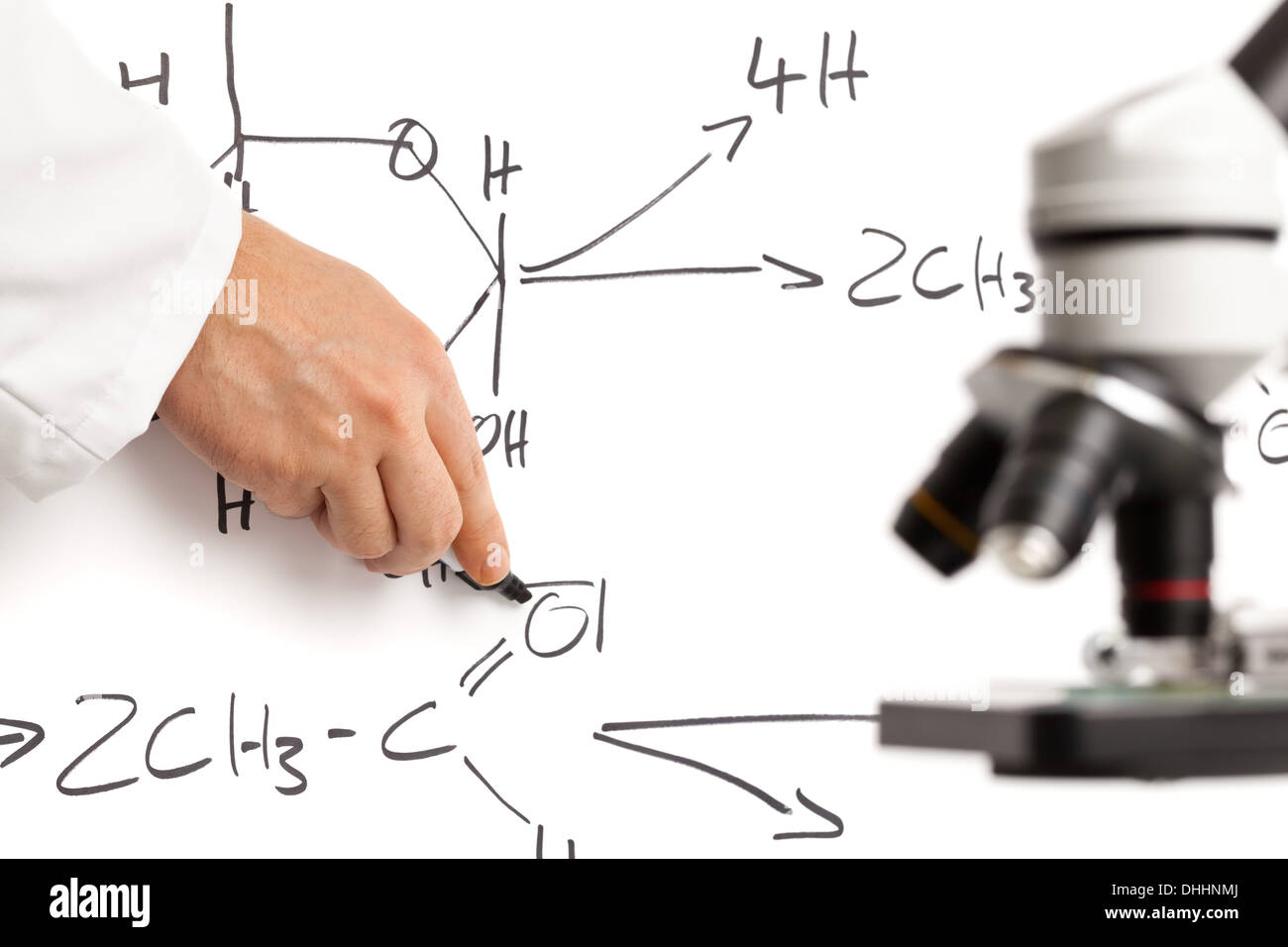 Teacher or scientist explaining chemical process on whiteboard with ...