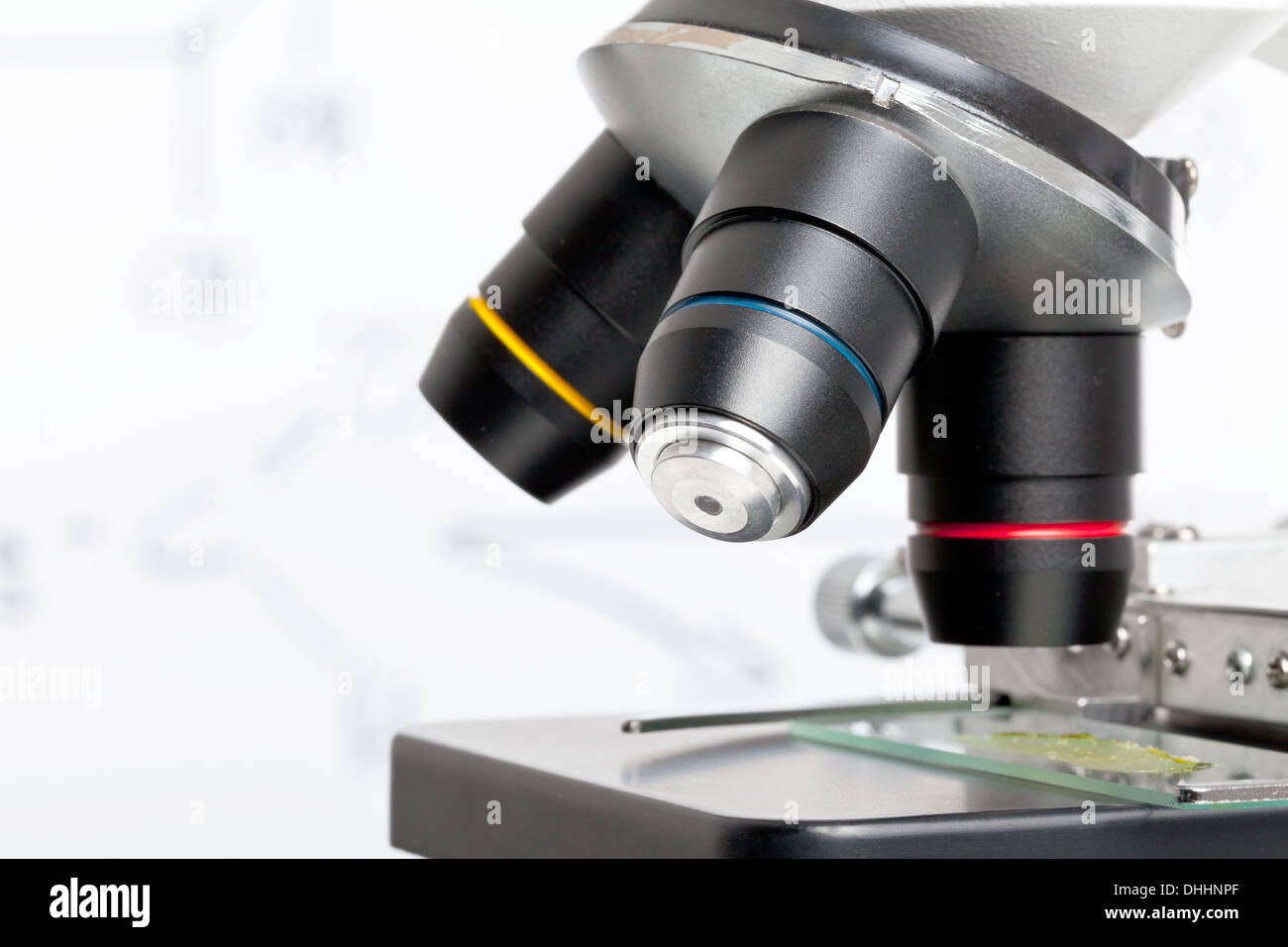 Microscope in front of whiteboard with chemical formula Stock Photo - Alamy
