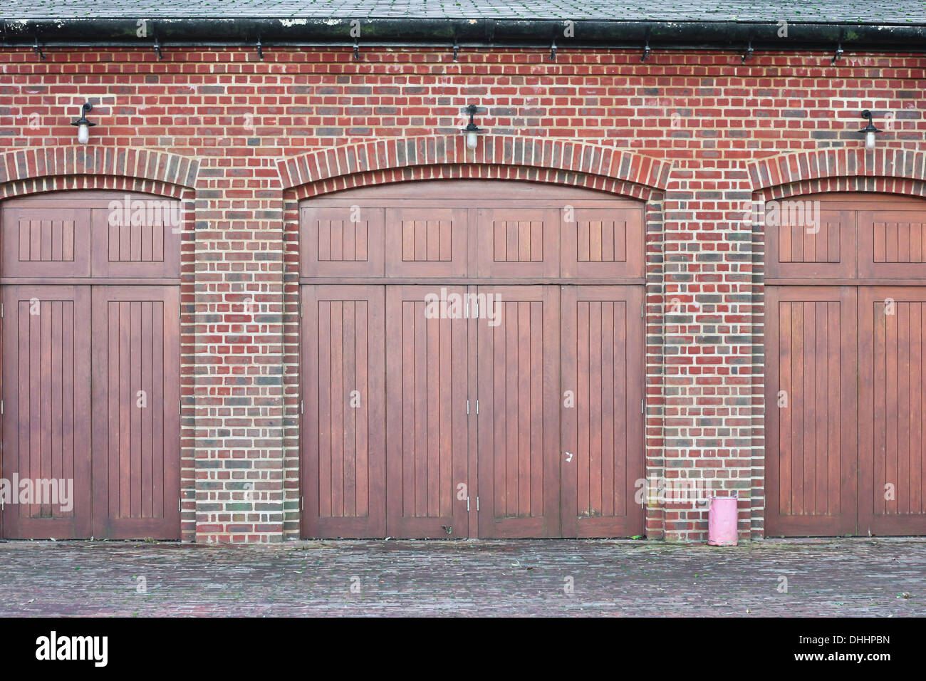 Large wooden doors in a brick building Stock Photo - Alamy